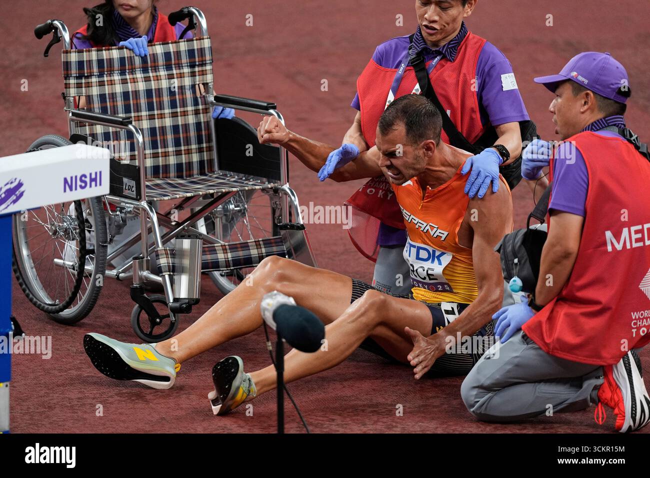 Spain's Daniel Arce tries to get in a wheelchair after falling in a men ...