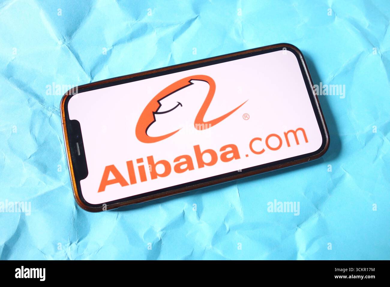 In this photo illustration, the Alibaba company logo is seen displayed ...
