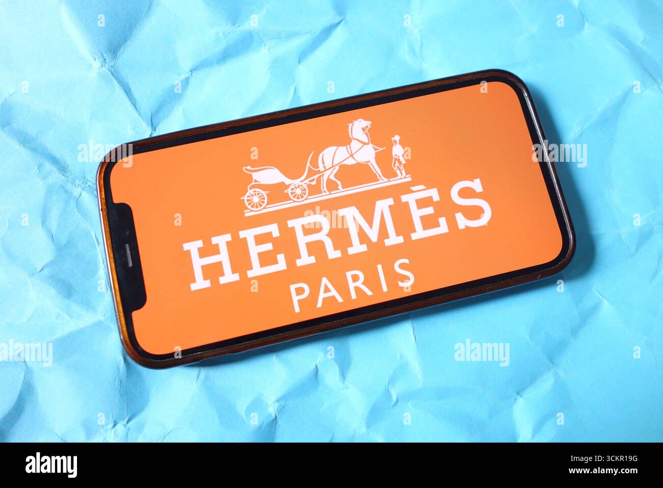 In this photo illustration, the Hermes company logo is seen displayed ...