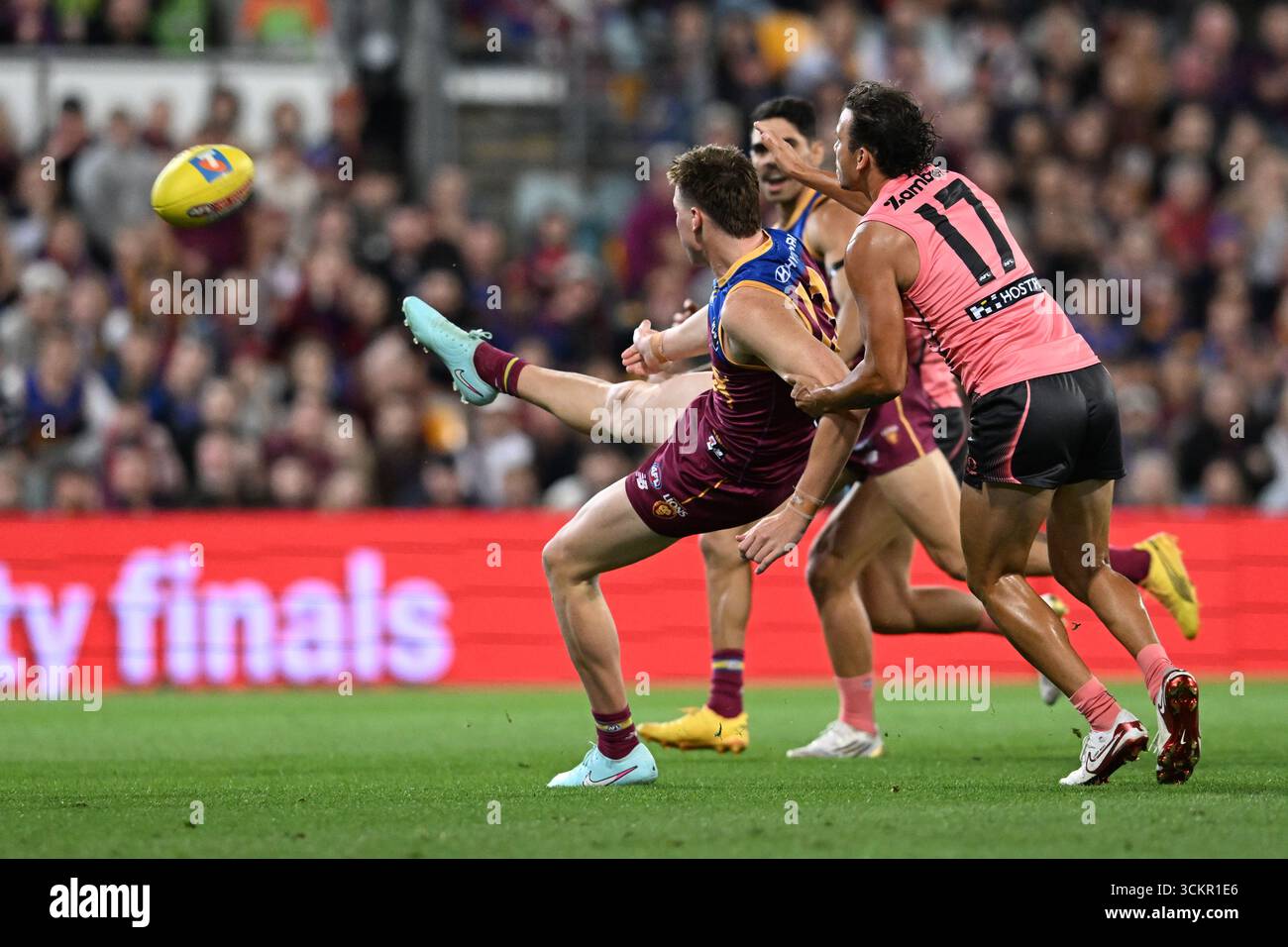 Logan Morris (left) of the Lions kicks a goal during the AFL Semi-Final ...