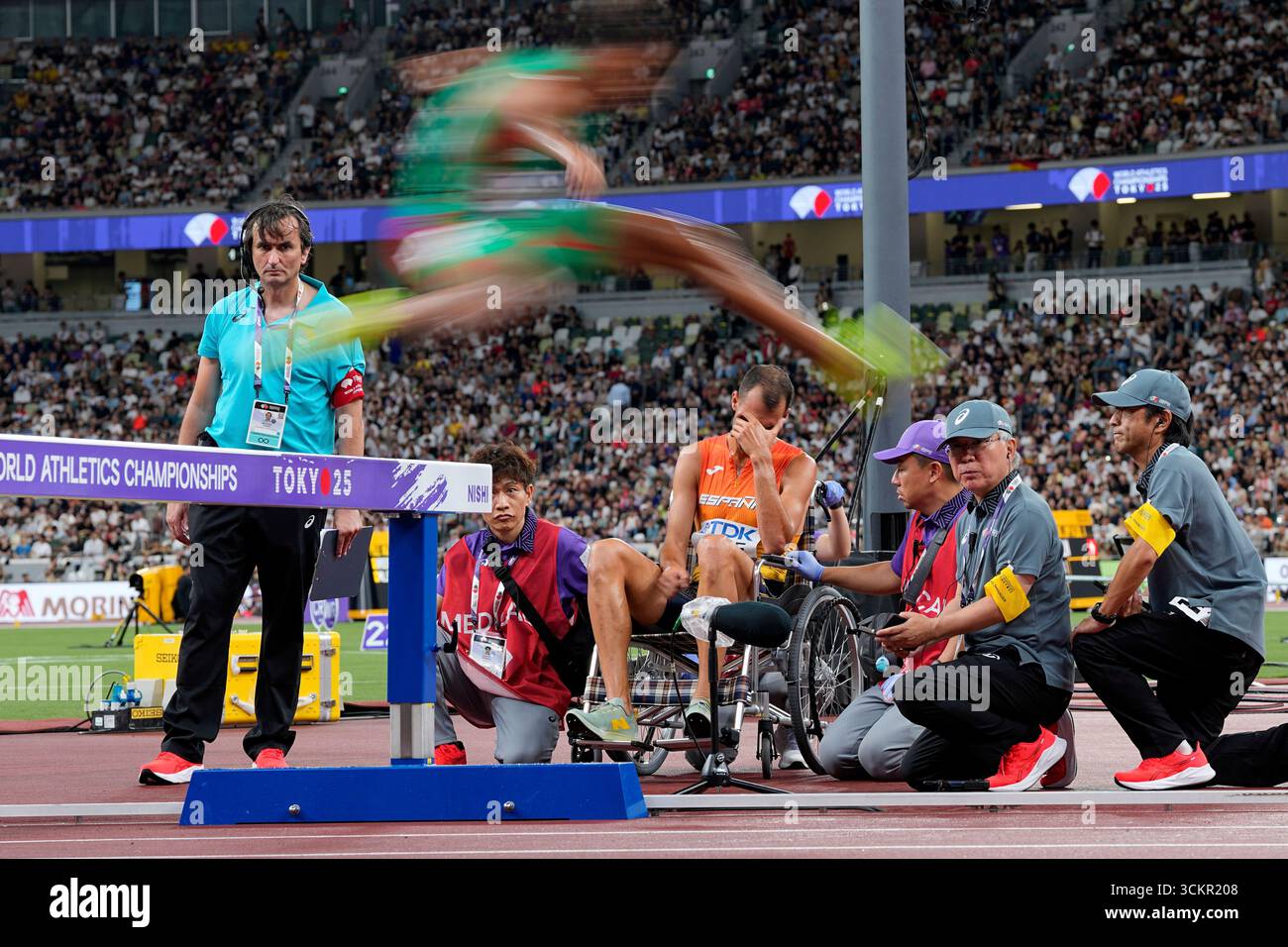 Spain's Daniel Arce reacts as other athletes compete after he fell ...