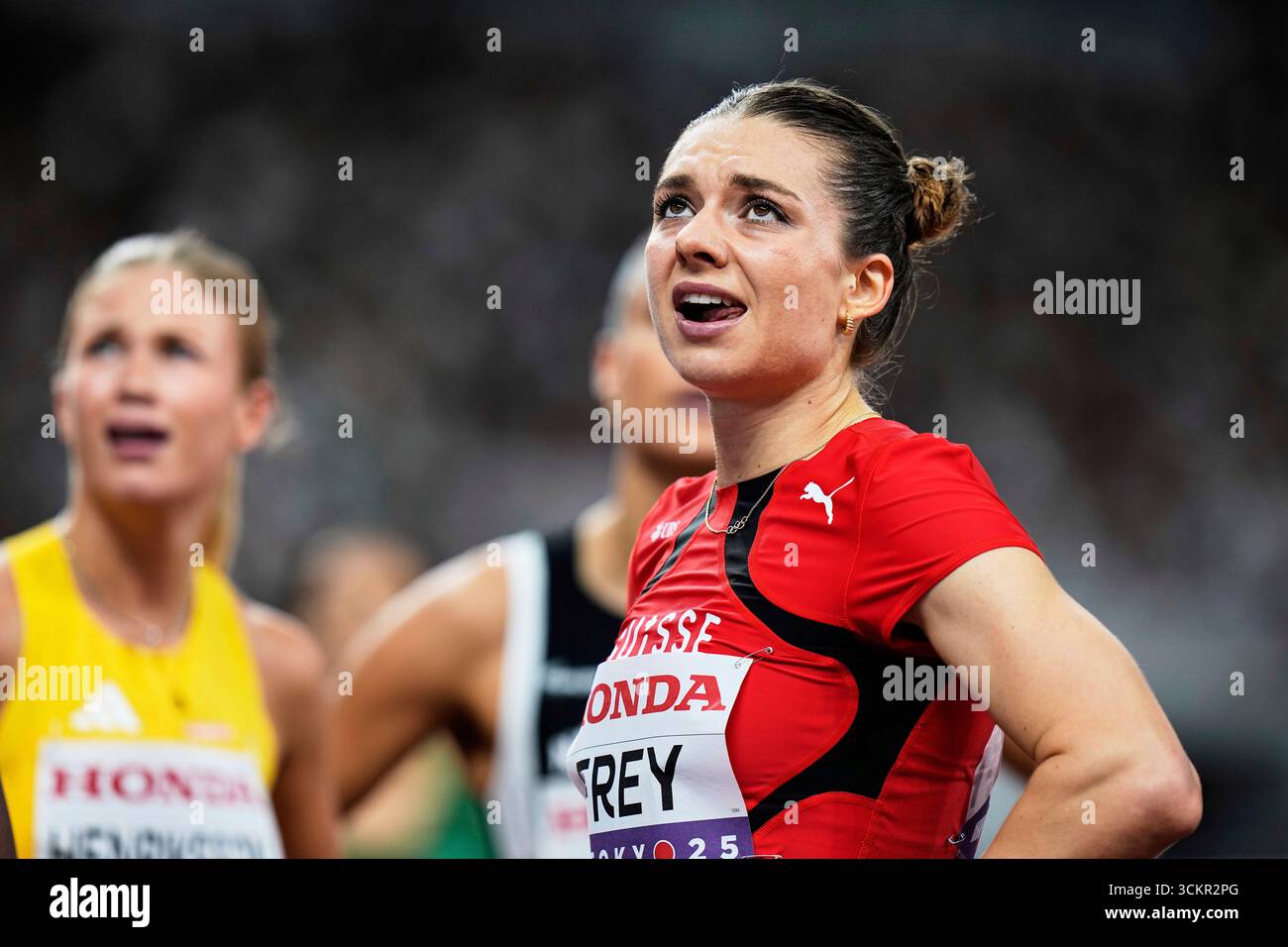Switzerland's Geraldine Frey, right, after competing in the women's 100 meters heat at the World ...
