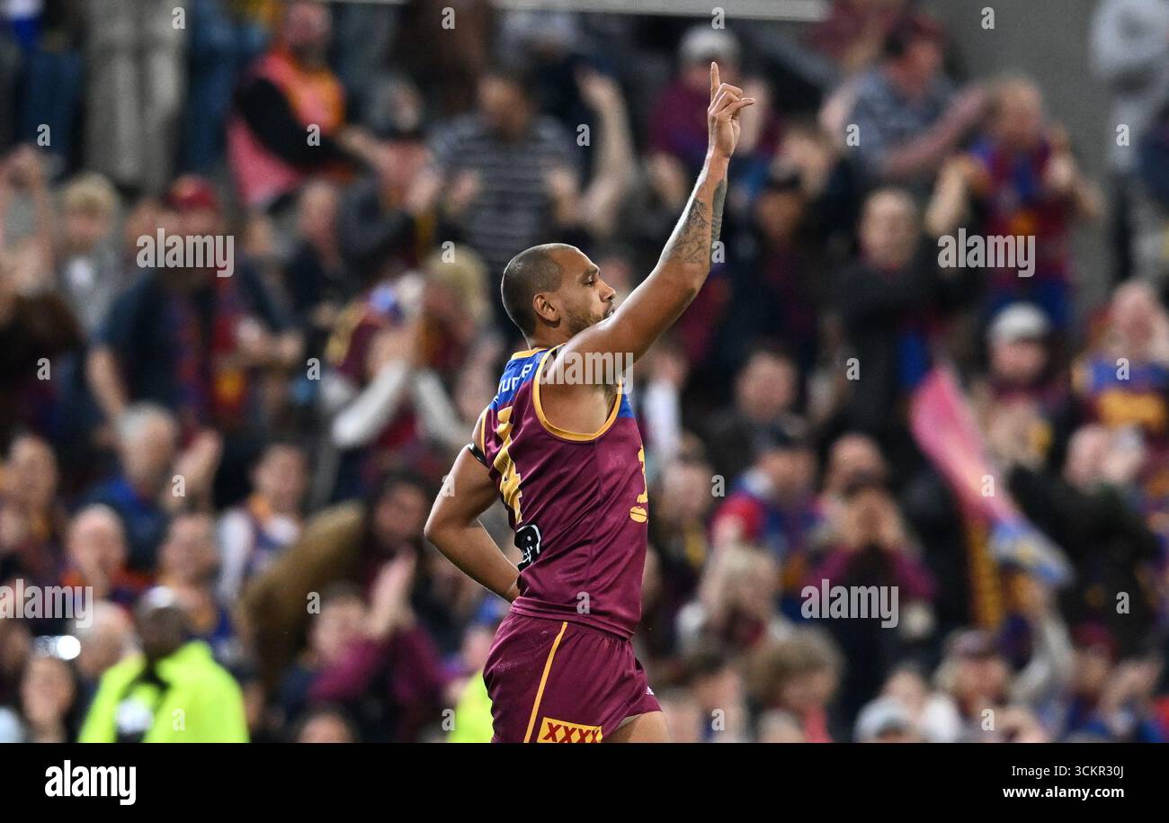 Callum Ah Chee of the Lions celebrates kicking a goal during the AFL ...