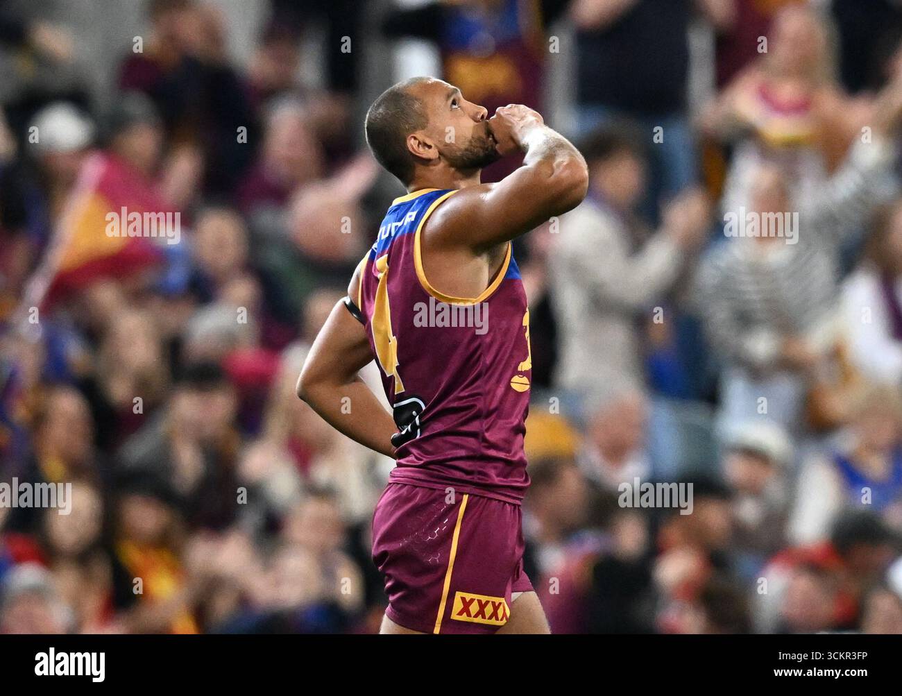 Callum Ah Chee of the Lions celebrates kicking a goal during the AFL ...