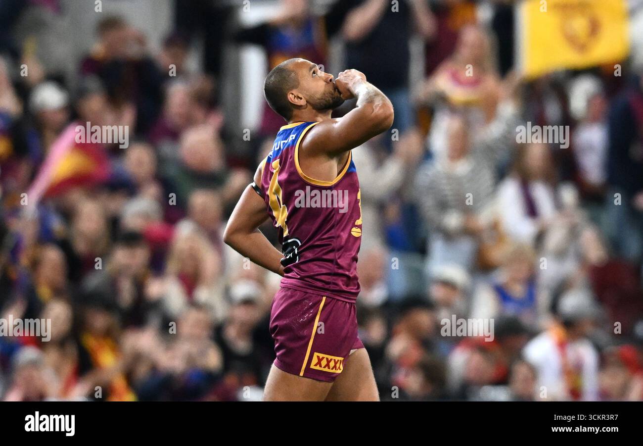 Callum Ah Chee of the Lions celebrates kicking a goal during the AFL ...