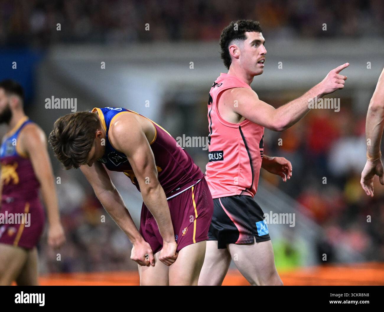 Sam Flanders (right) of the Suns celebrates kicking a goal during the ...