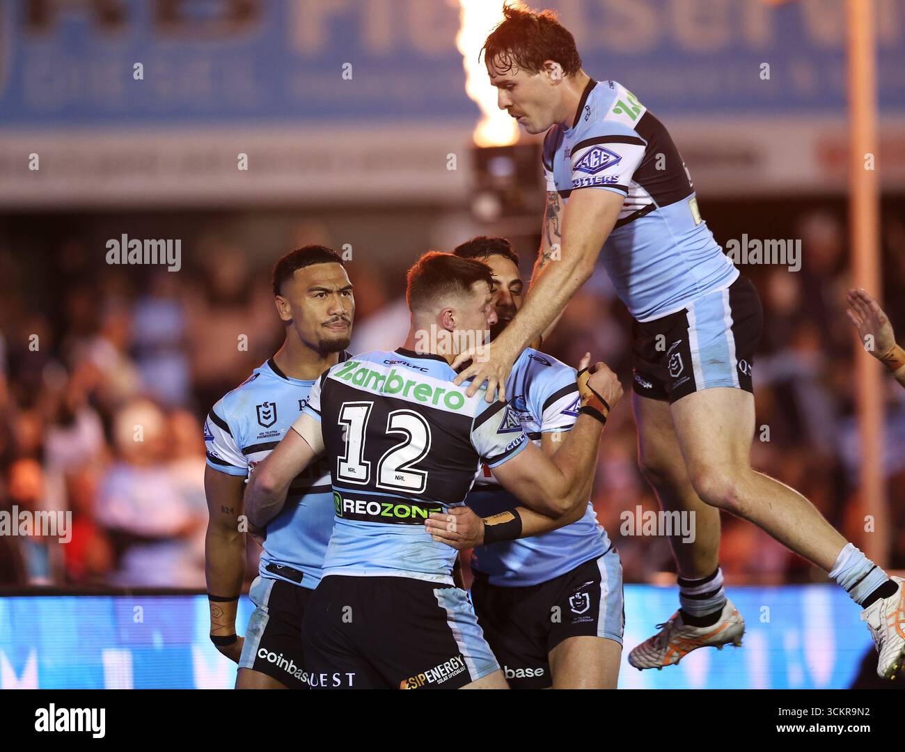 Ronaldo Mulitalo of the Sharks celebrates with his team mates after ...