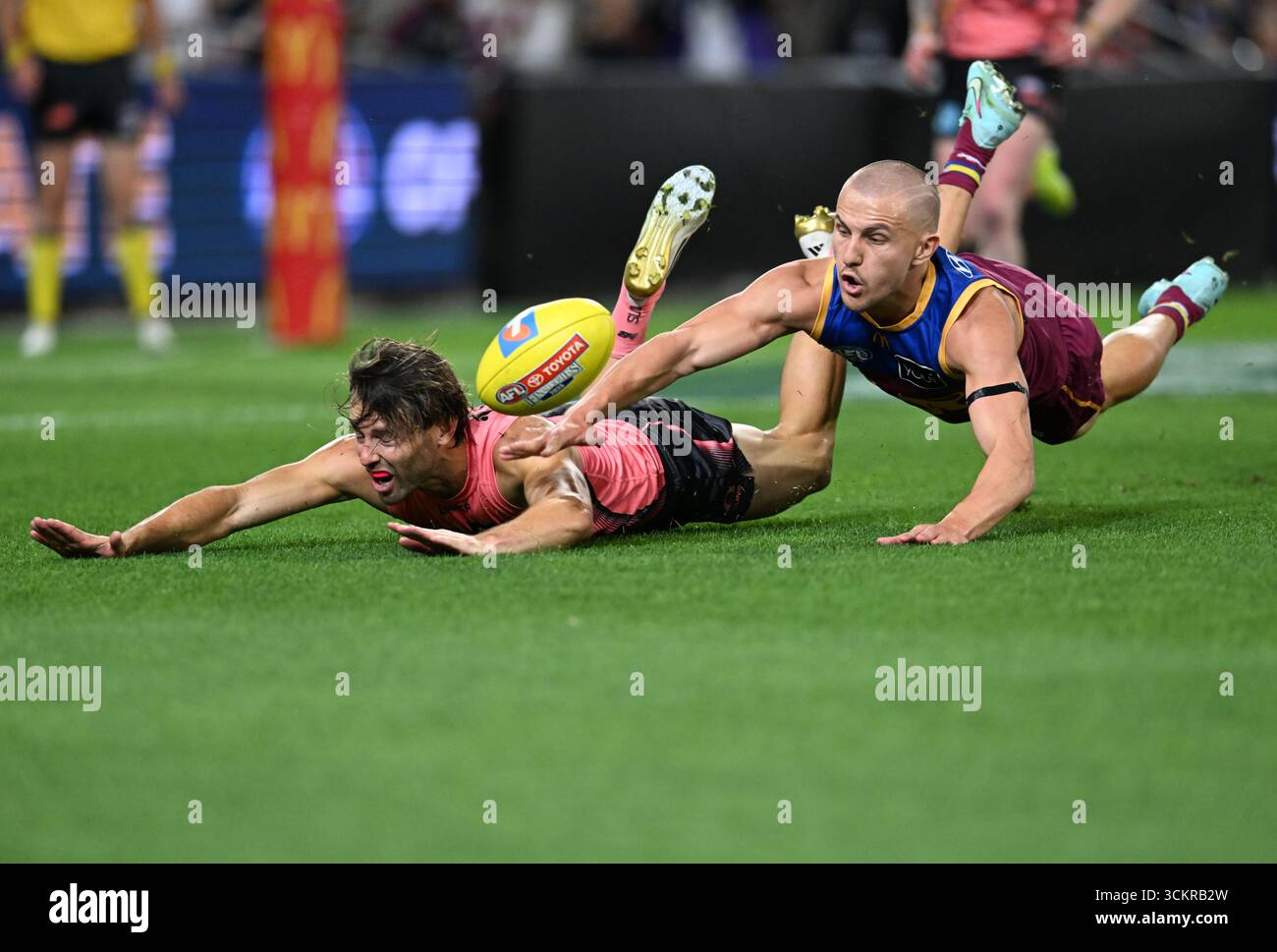 Lachie Weller (left) of the Suns and Kai Lohmann (right) of the Lions ...