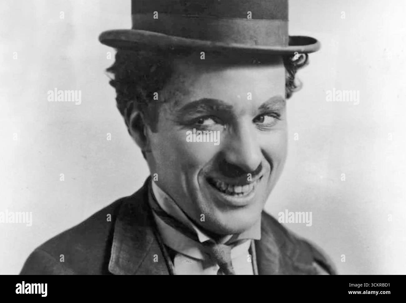 CHARLES CHAPLIN (1889-1977) English film actor, director, as The Tramp ...