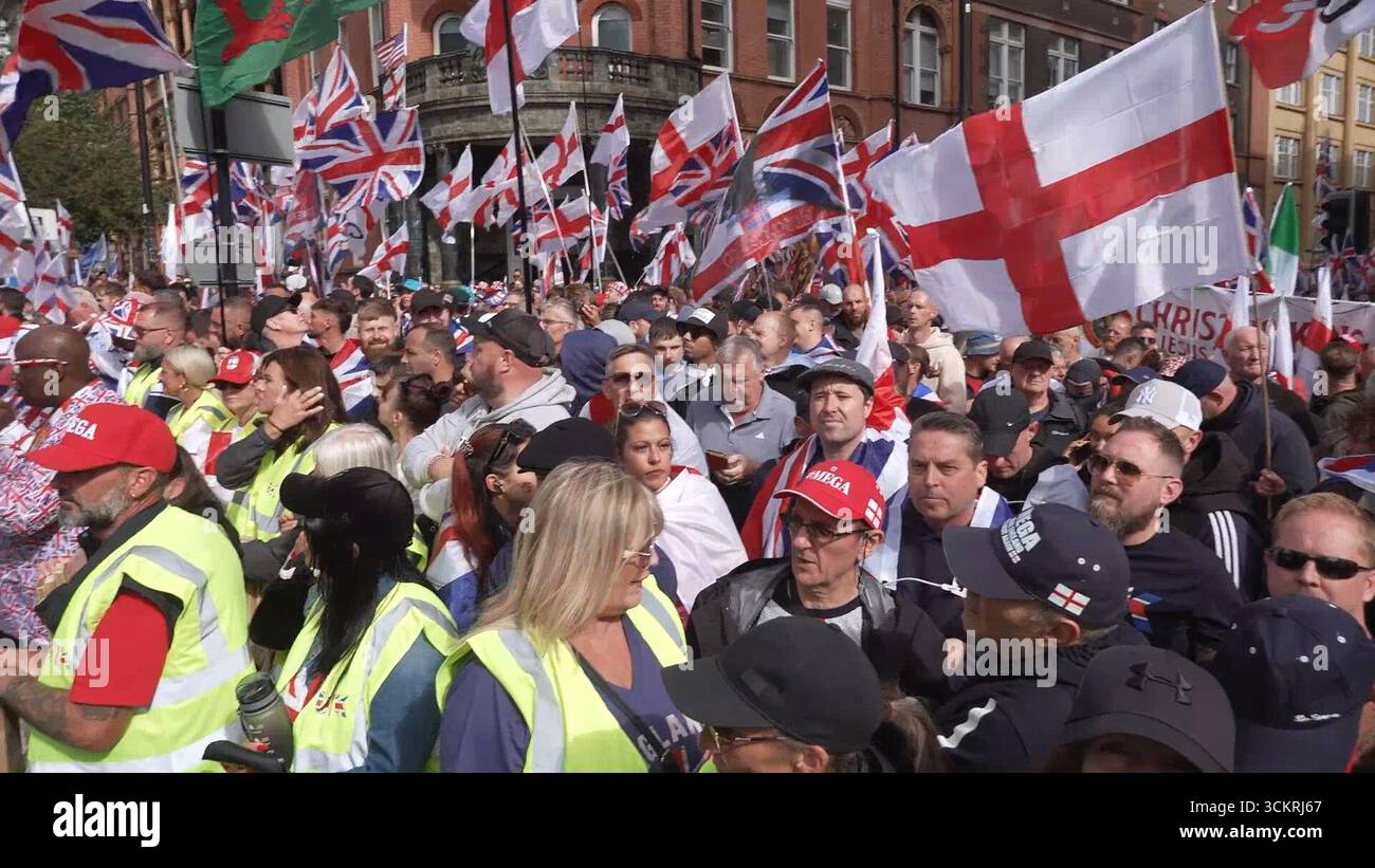 People fly Union Flags and the St George Cross during a Tommy Robinson ...