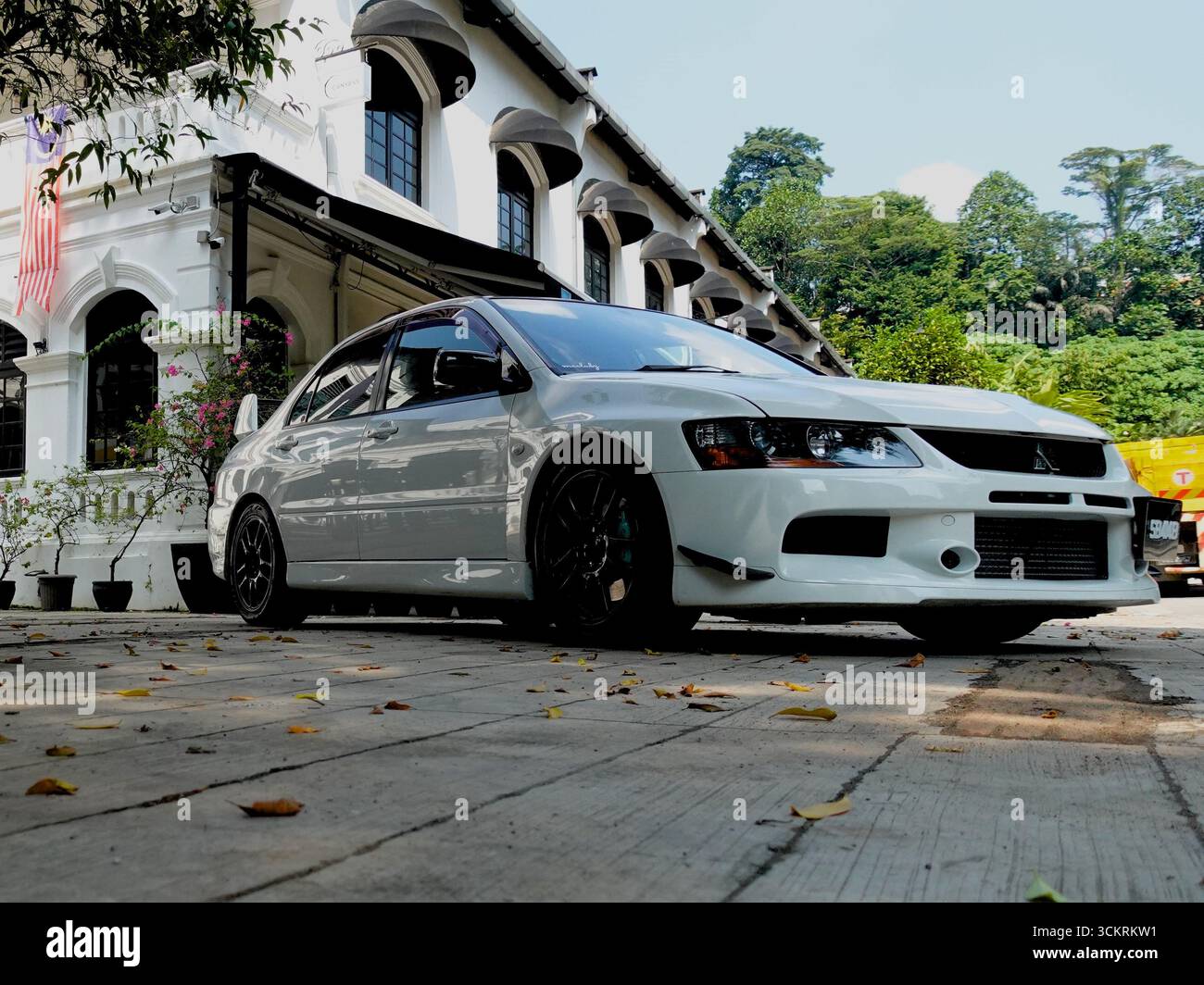 White Mitsubishi Evo 9 on an urban street Stock Photo - Alamy