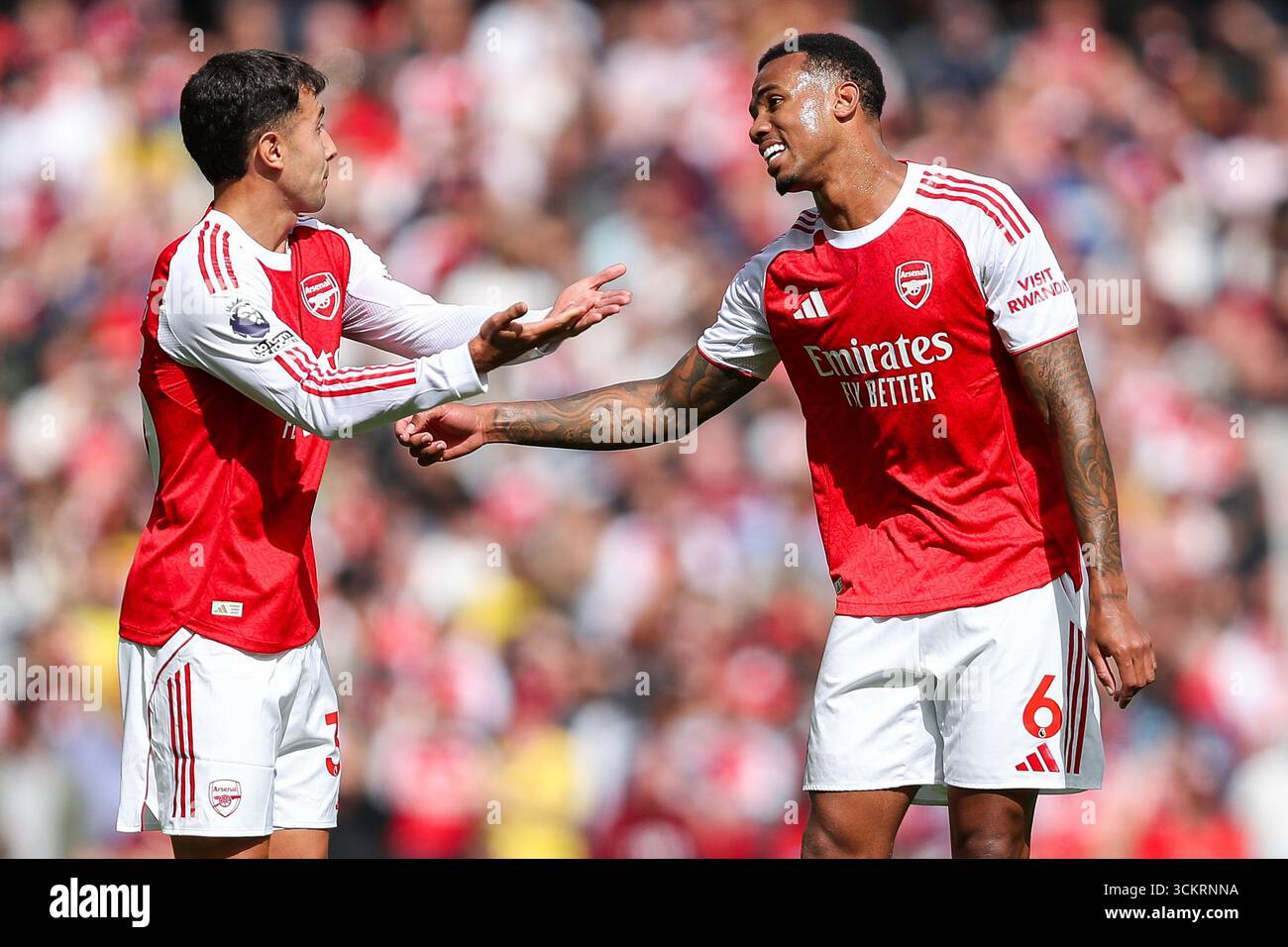 Cristhian Mosquera of Arsenal speaks to Gabriel Magalhaes during the ...