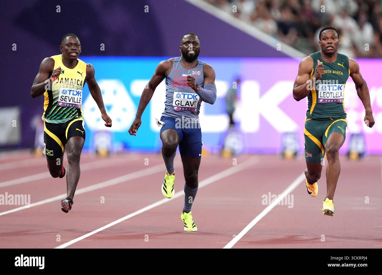 Romell Glave of Great Britian (centre) competes in heat 1 of the Men's ...