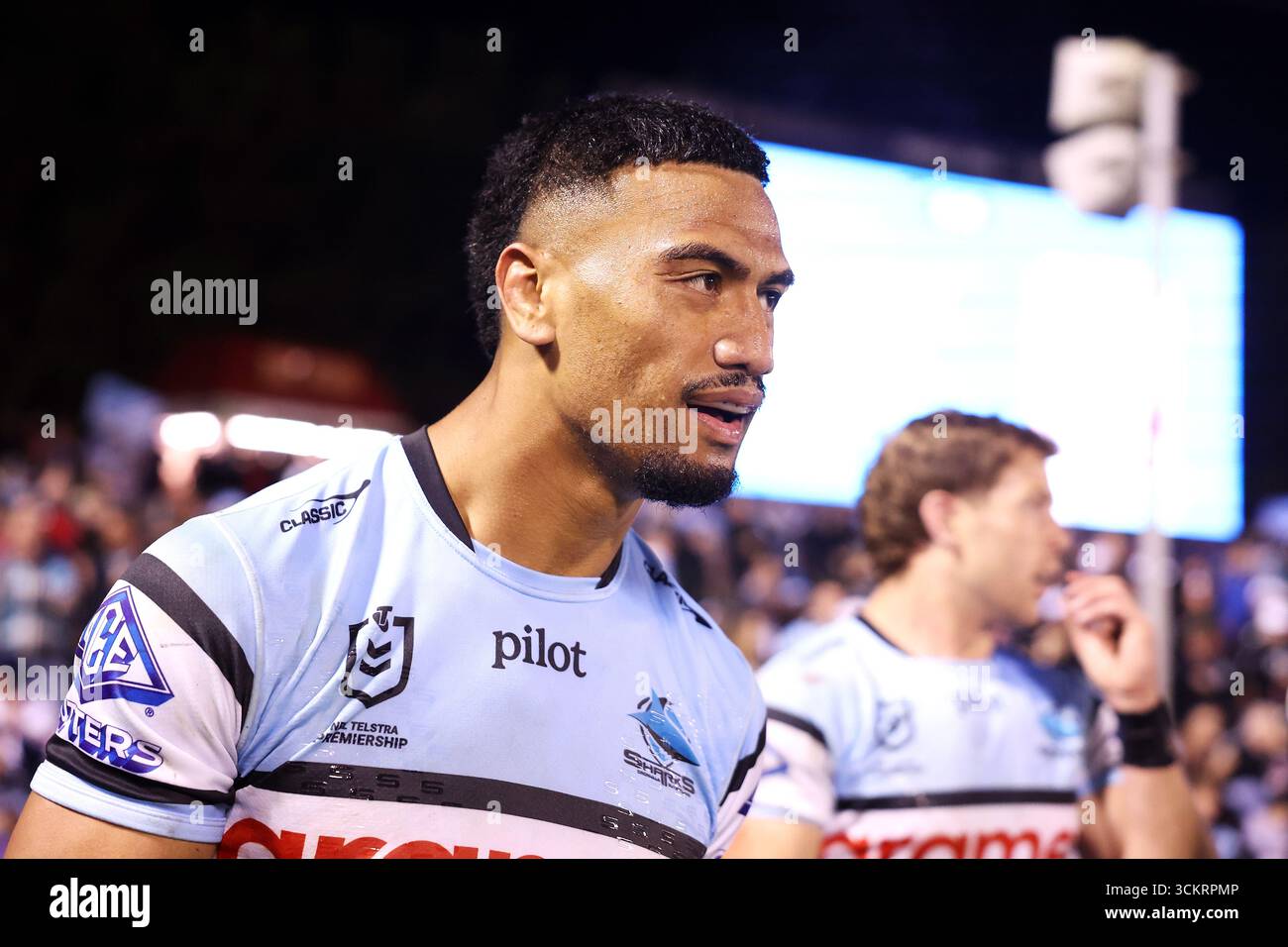 Ronaldo Mulitalo of the Sharks celebrates scoring a try during the NRL ...