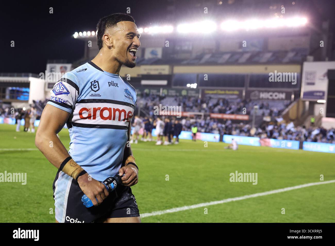 Ronaldo Mulitalo of the Sharks celebrates victory during the NRL ...