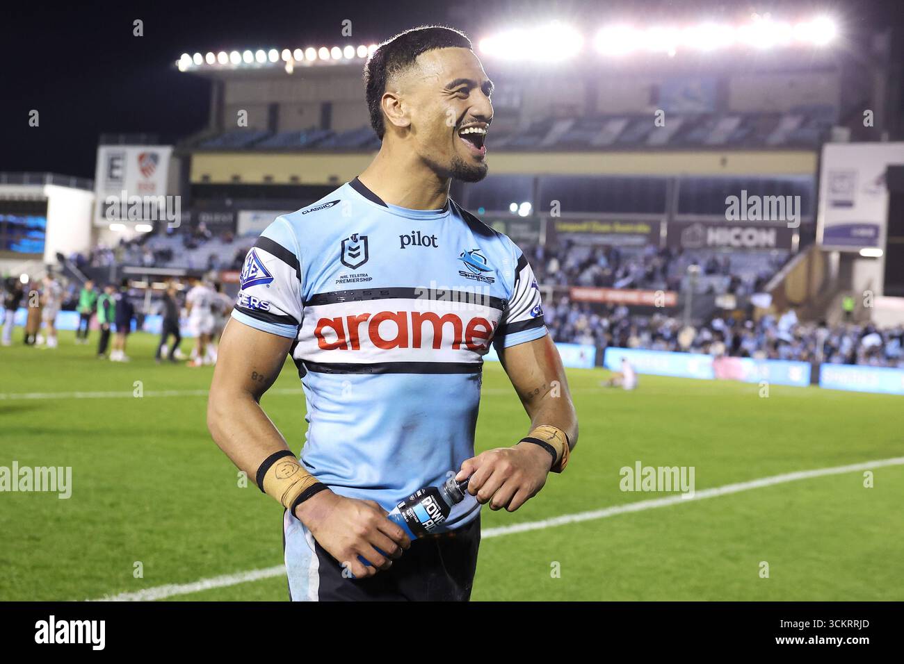 Ronaldo Mulitalo of the Sharks celebrates victory during the NRL ...