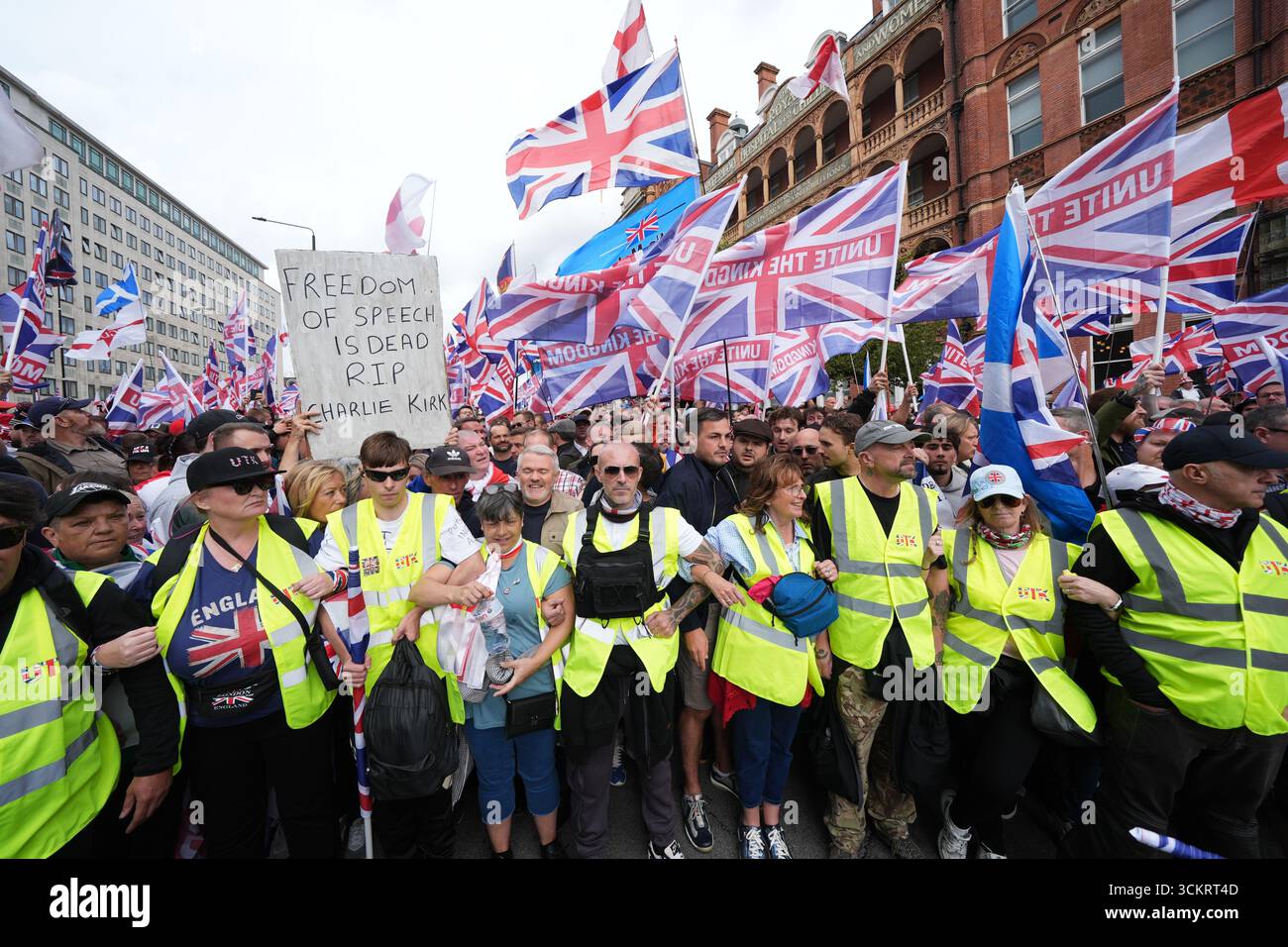 A posted reading 'RIP Charlie Kirk' is seen among the Union flags and ...