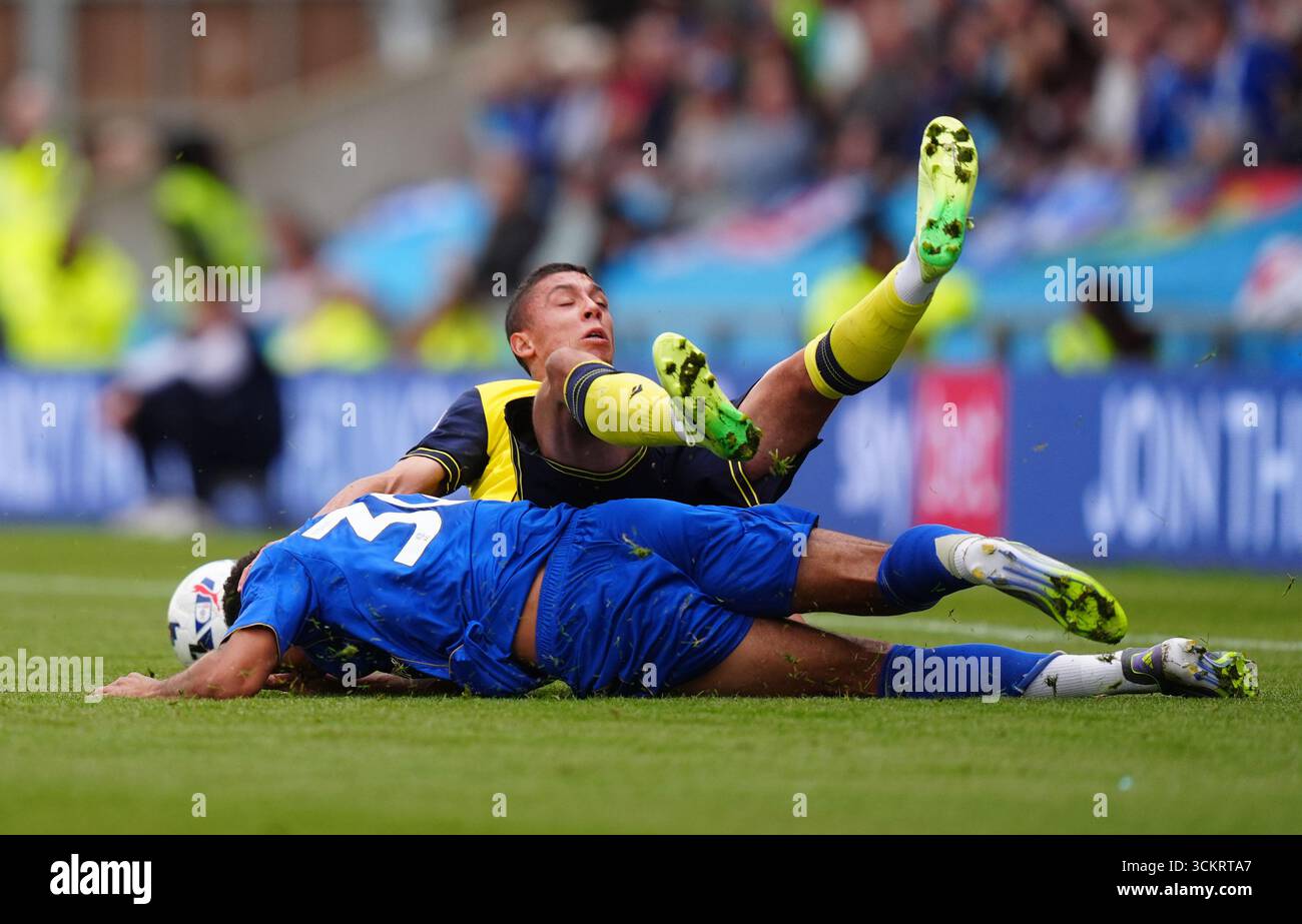 Leicester City's Aaron Ramsey fouls Oxford United's Filip Krastev ...