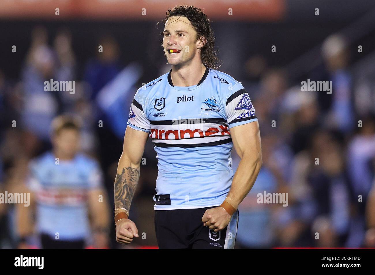 Nicholas Hynes of the Sharks celebrates victory during the NRL ...