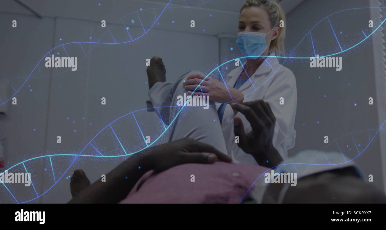 Manipulating patient knee by doctor in lab coat, mask in examination ...