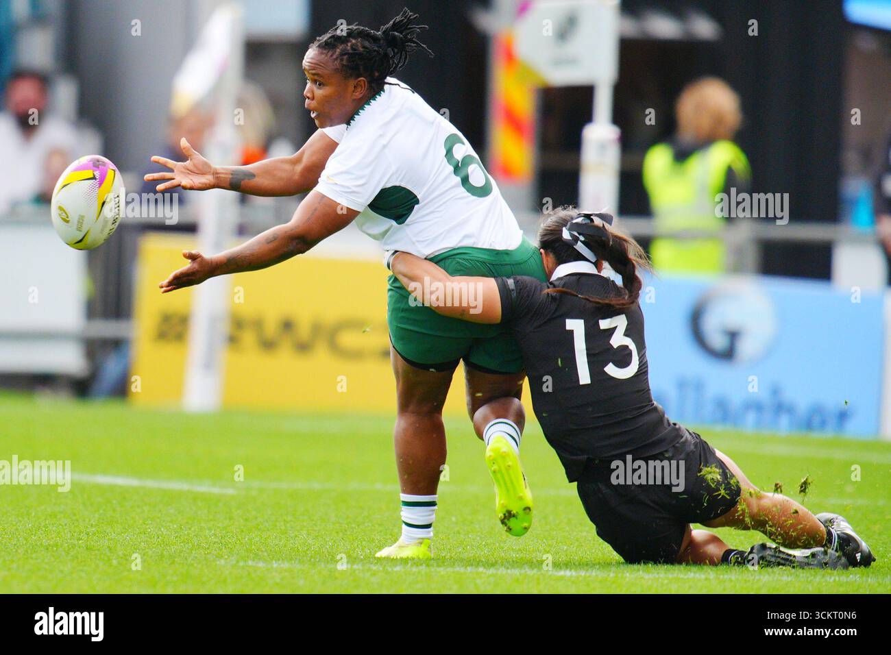 South Africa's Sizophila Solontsi (left) is tackled by New Zealand's ...