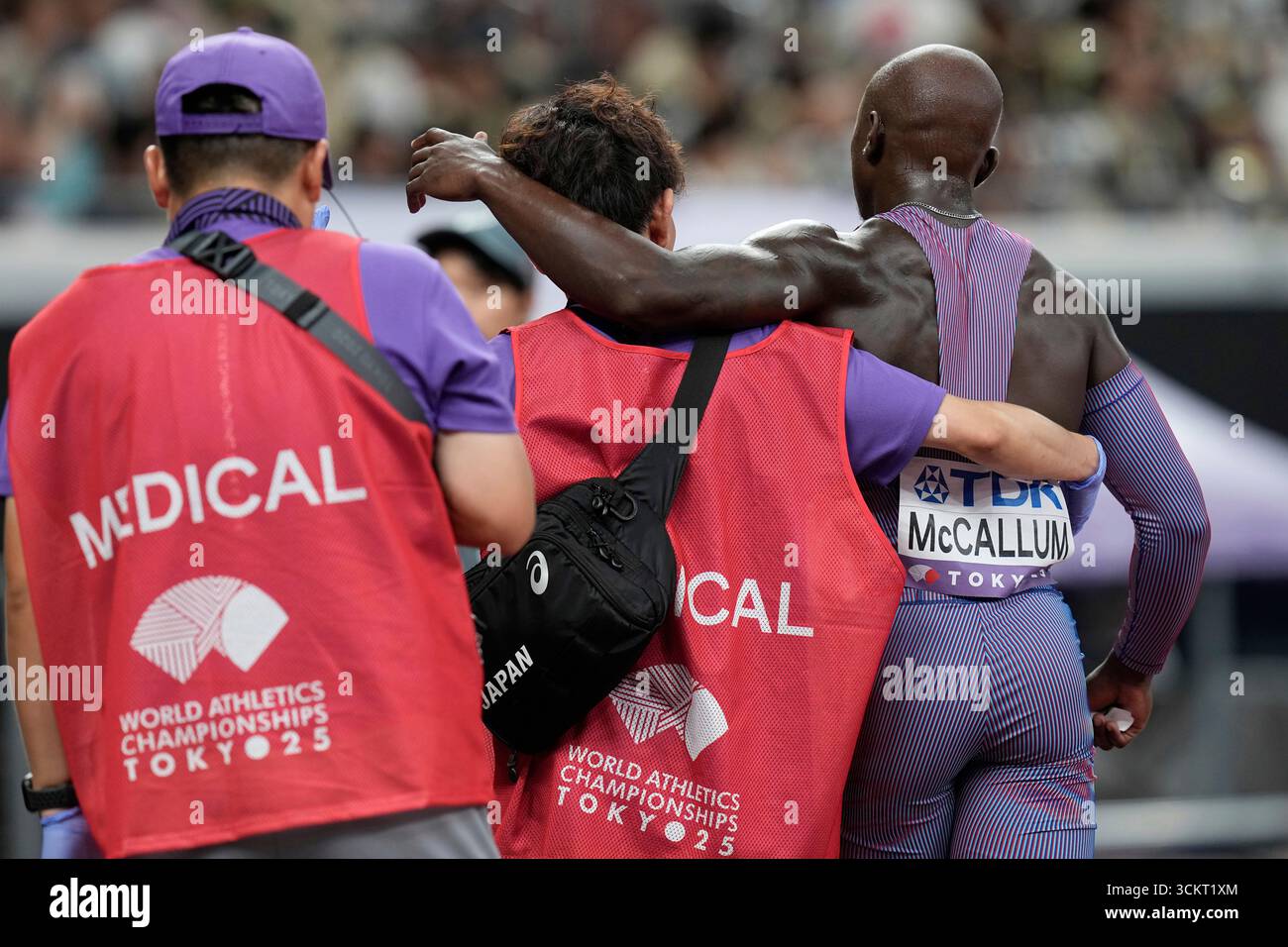 United States' T'Mars McCallum, right, is helped by the medical team ...