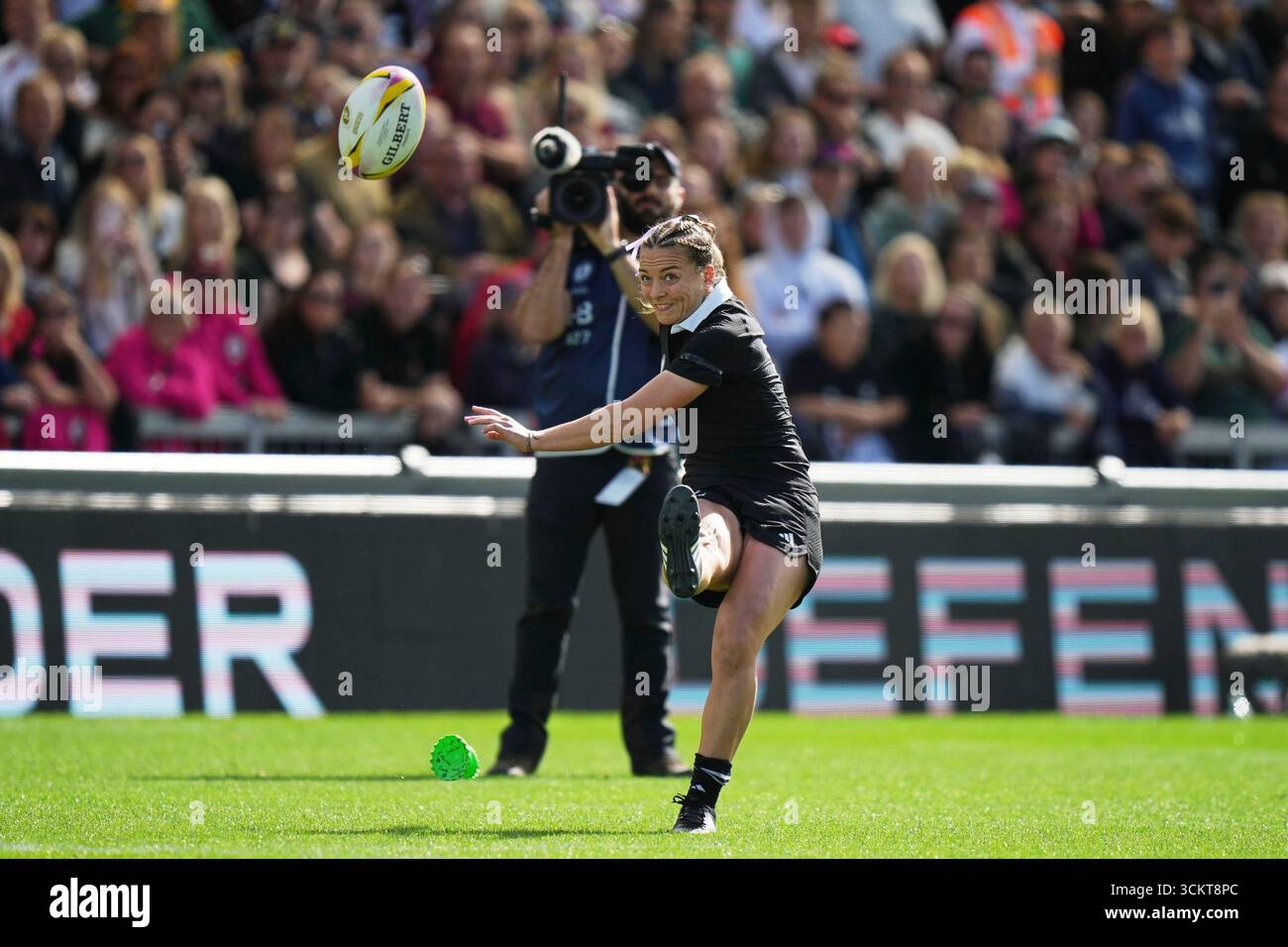 New Zealand's Renee Holmes kicks the ball and converts a try during the ...
