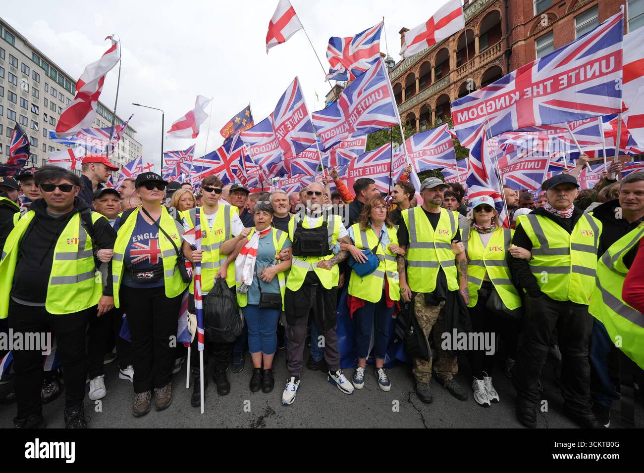 Activists fly Union flags and the St George Crosses during the Tommy ...