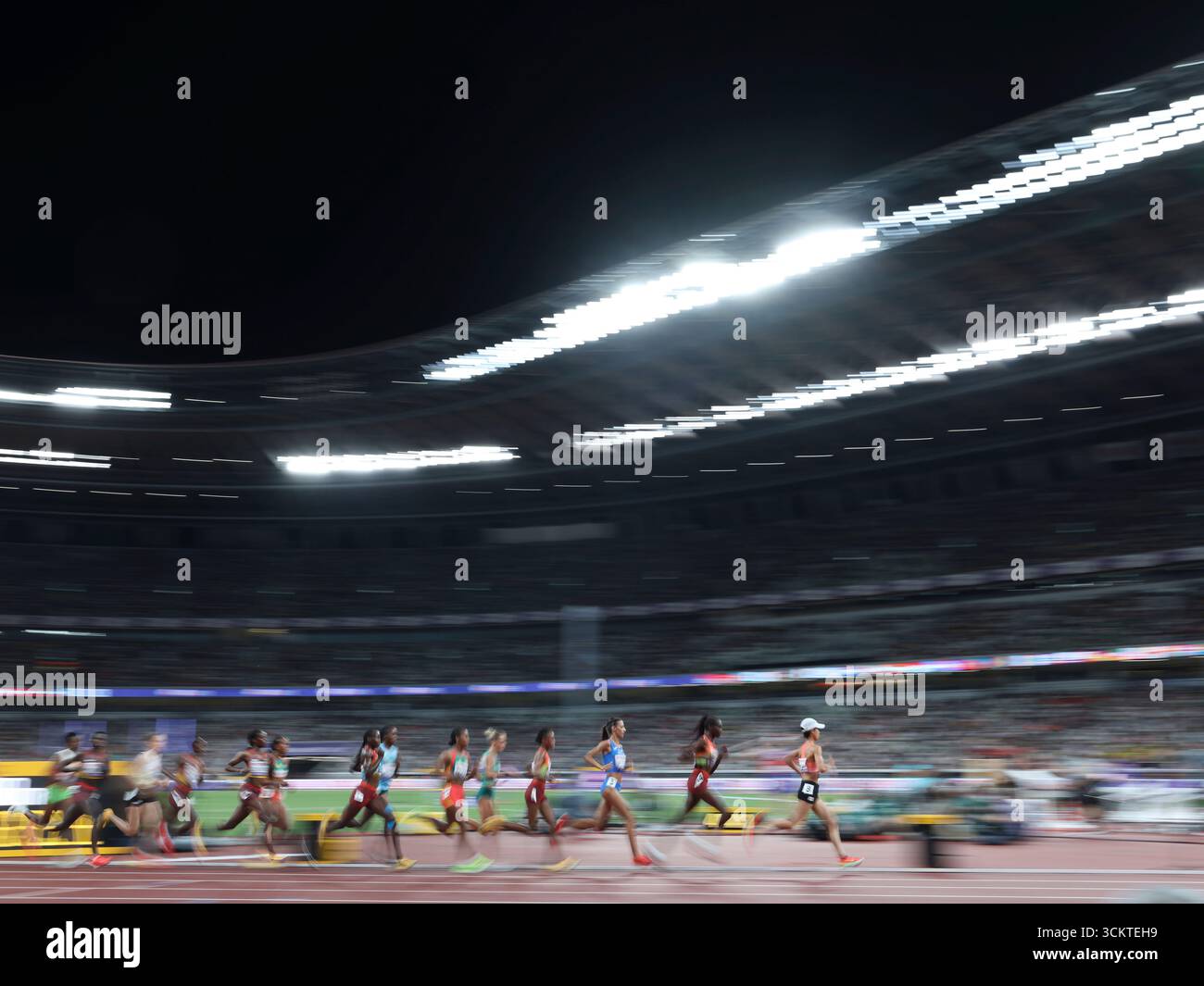 Athletes compete during the women's 10000 meters final at the World ...