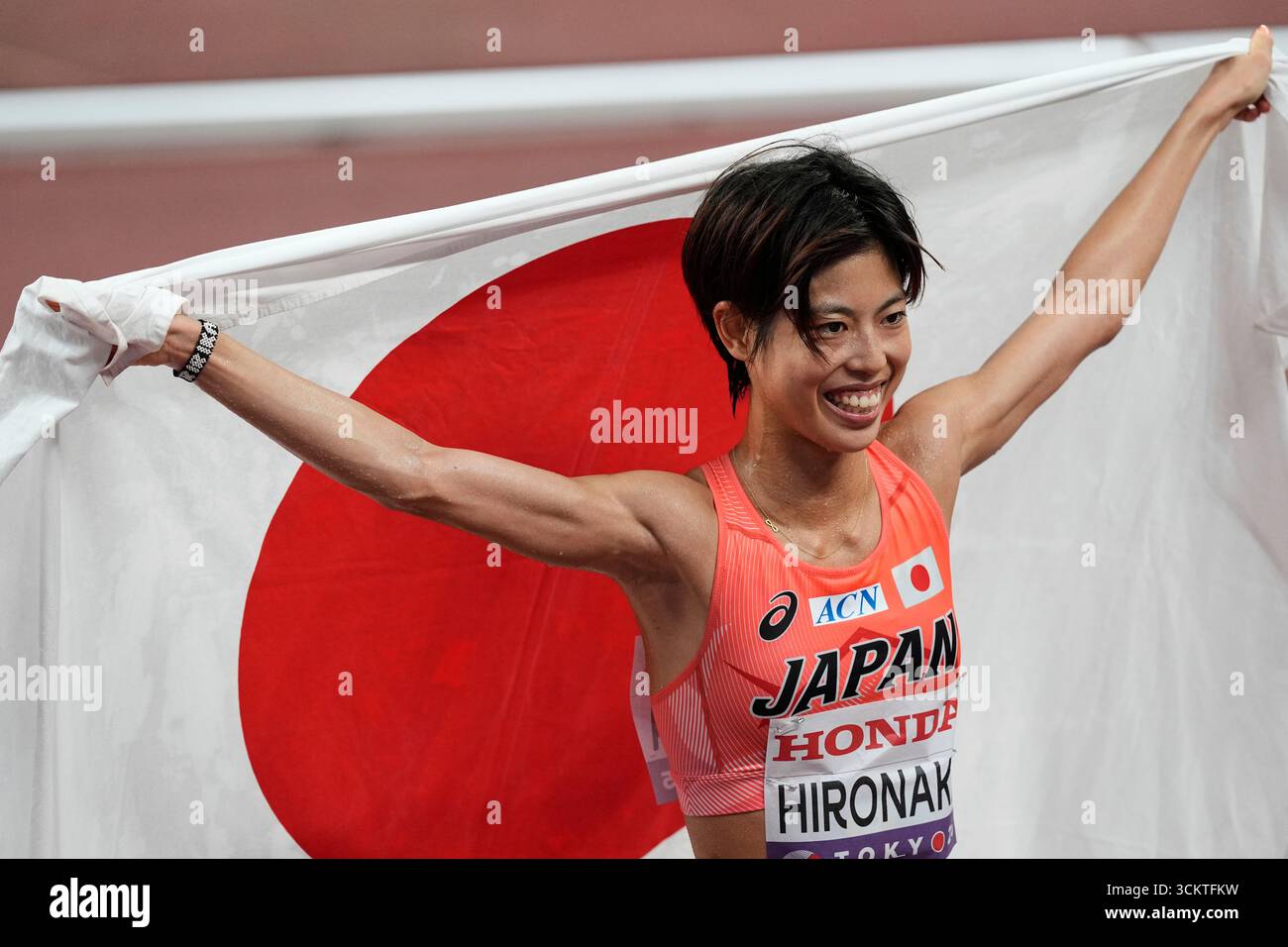 Japan's Ririka Hironaka celebrates after the women's 10,000 meters ...