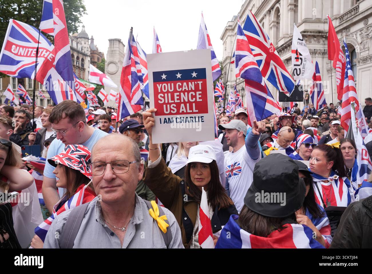 A woman holds a placard with the words "I Am Charlie" during the Tommy ...