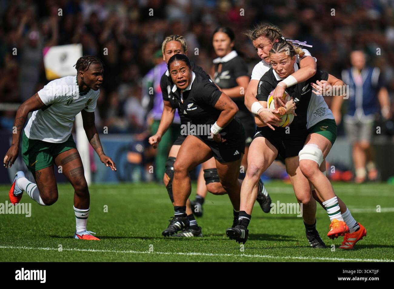 New Zealand's Renee Holmes, front, is tackled by South Africa's Catha ...
