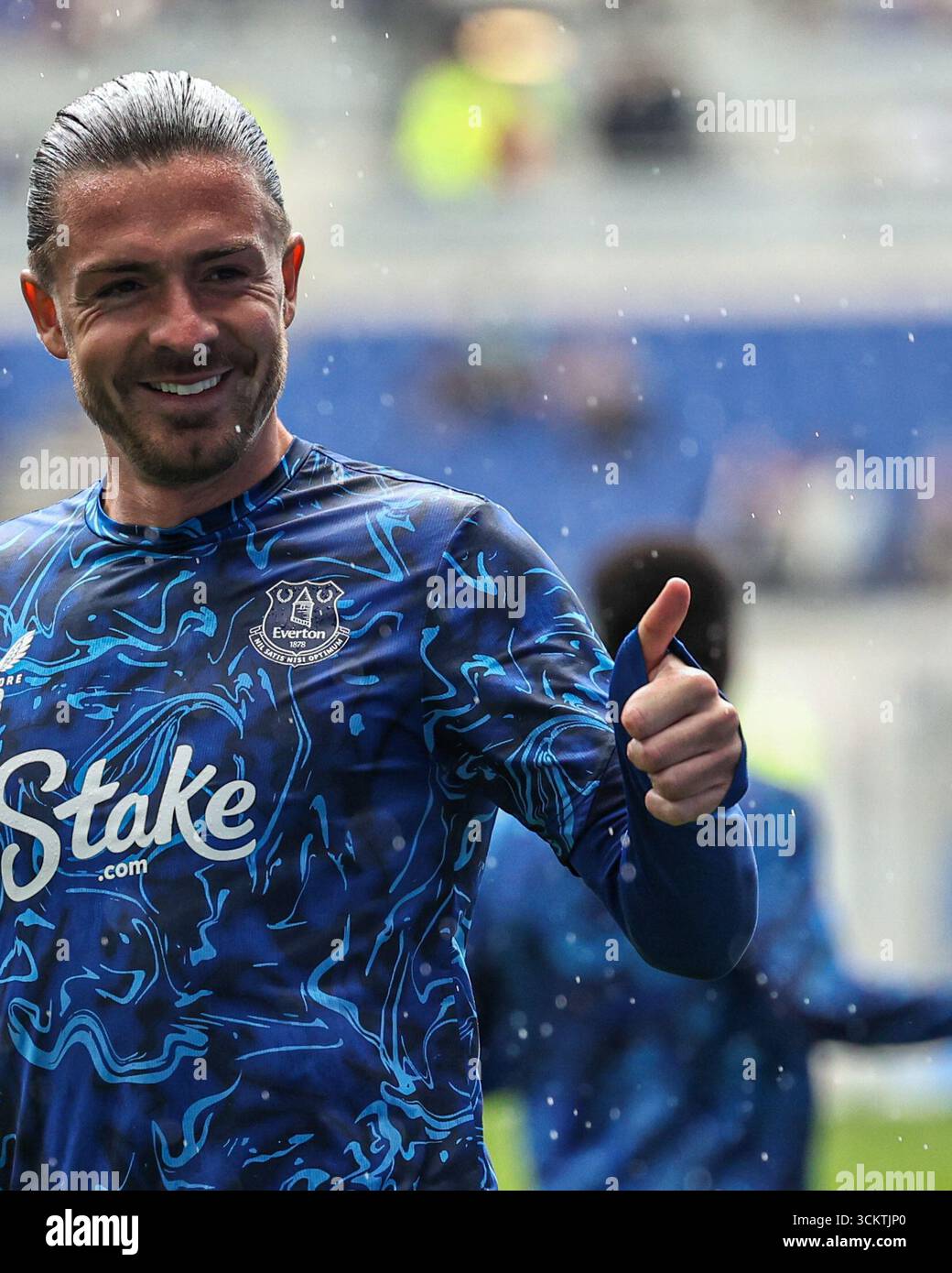 Jack Grealish of Everton warming up and gives a smile and thumbs up to ...