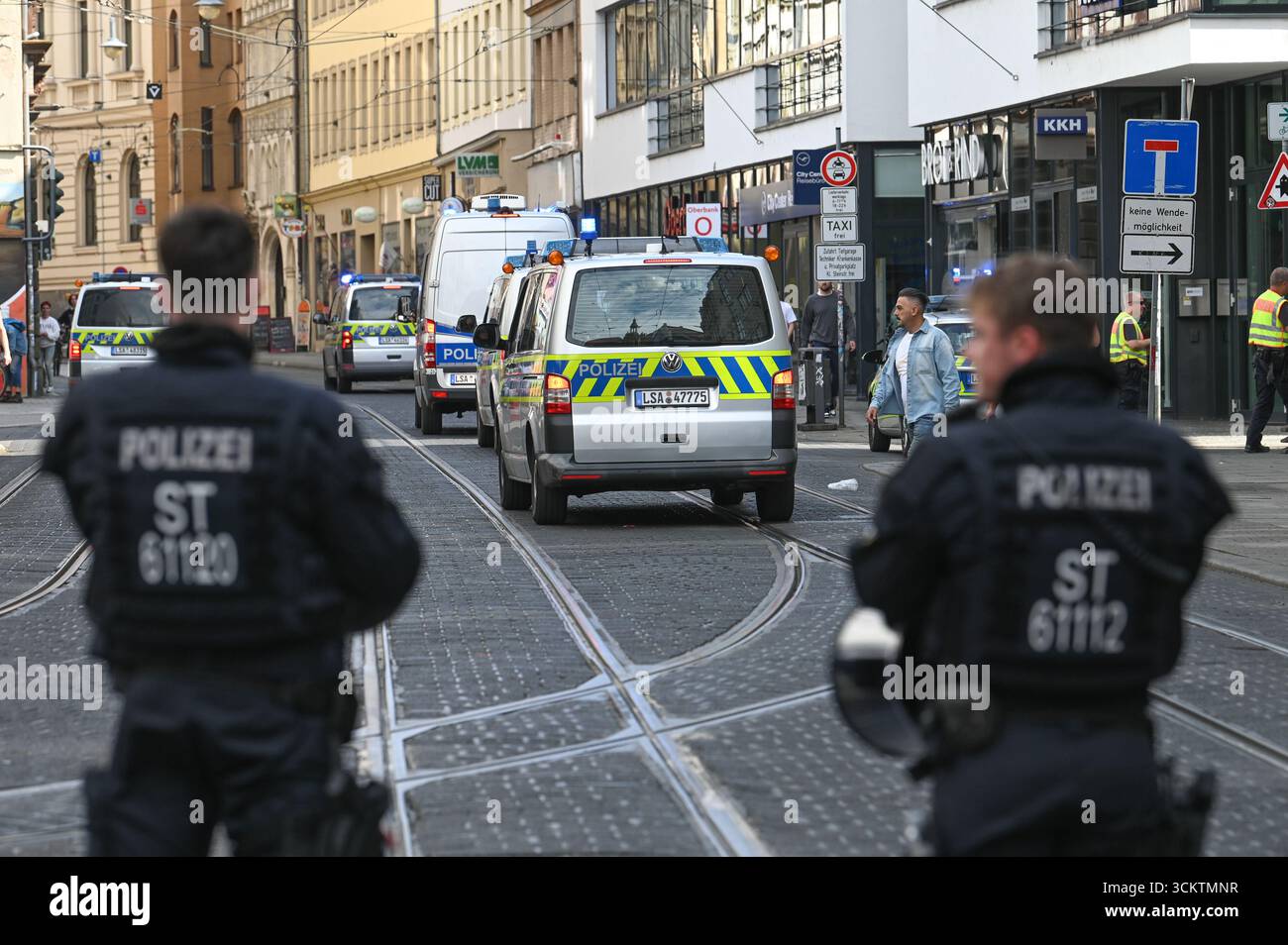13 September 2025, Saxony-Anhalt, Halle (Saale): Police vehicles are on ...