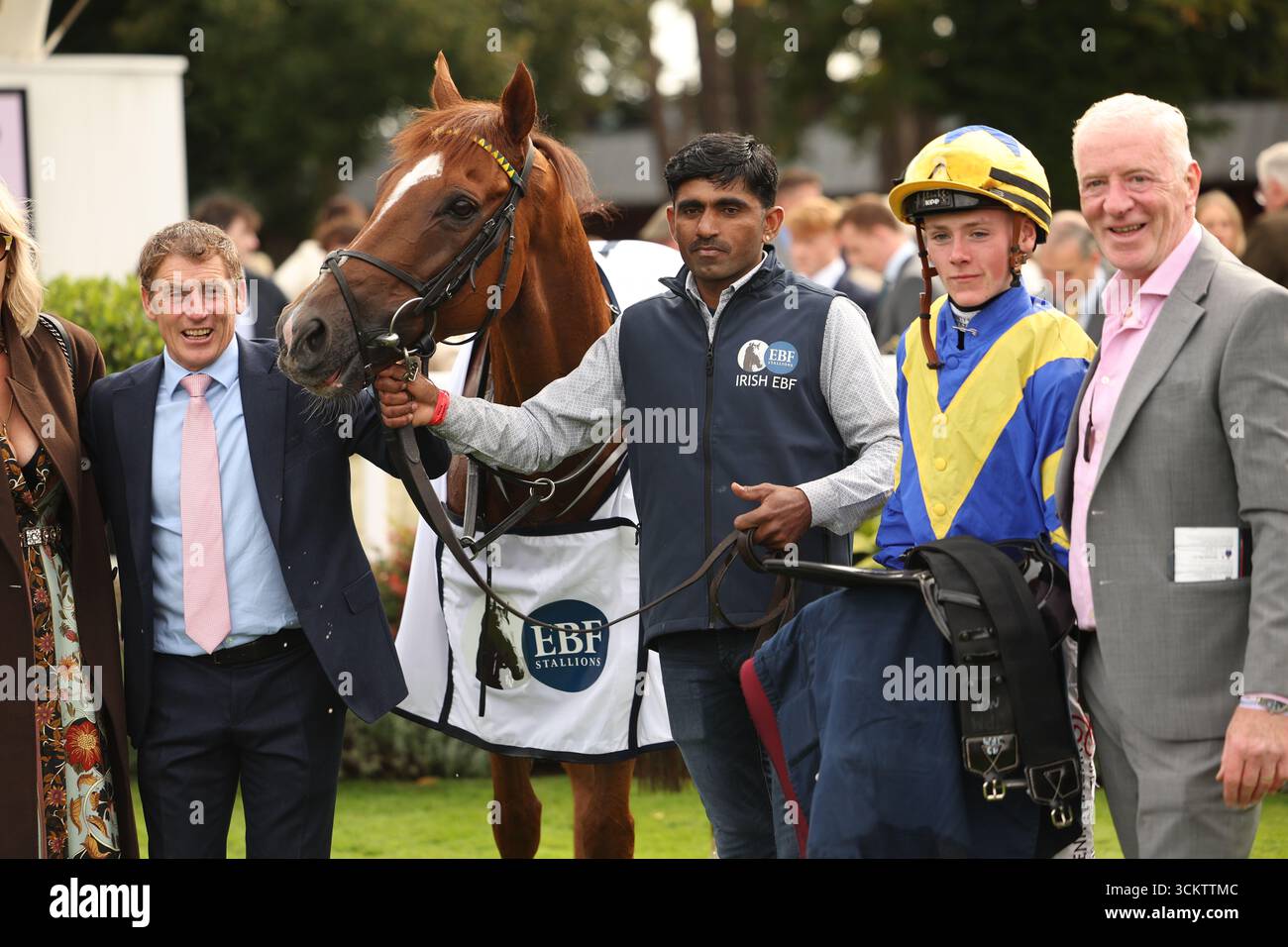 Jockey Rory Mulligan (2nd right) after riding Rahmi to victory in the ...