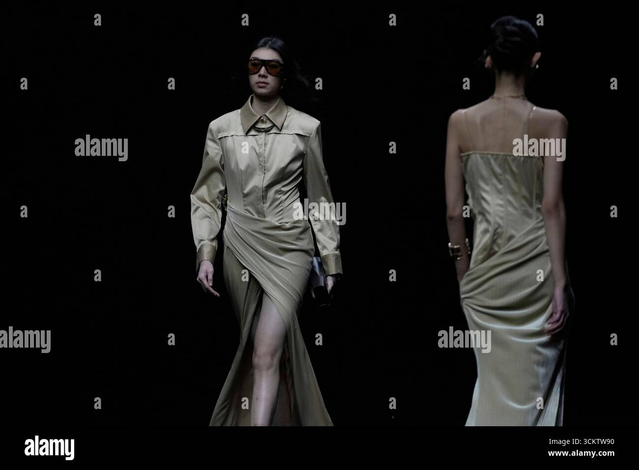 Models showcase a creation from the K+ collection by Kang Yu during the ...