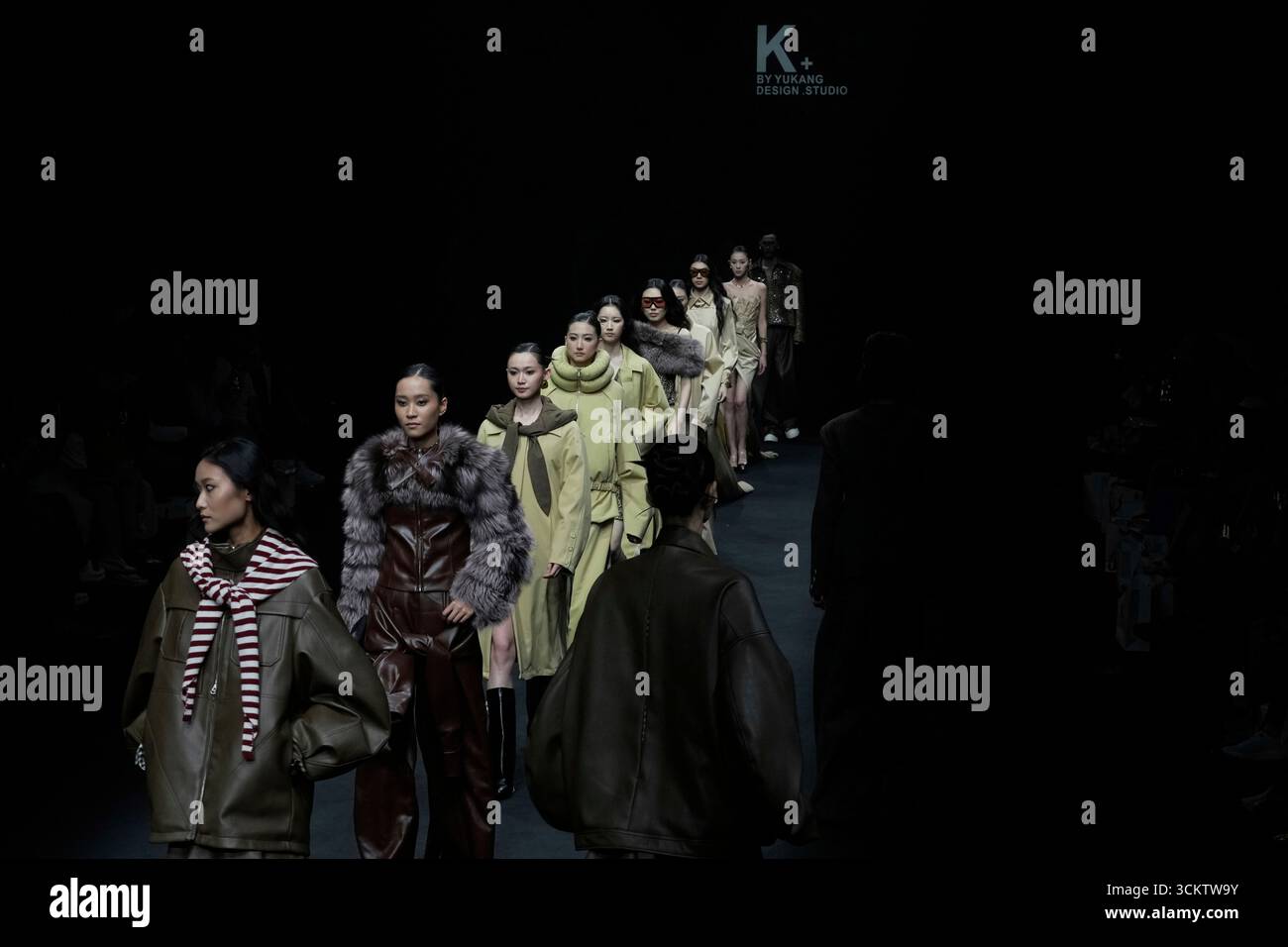 Models showcase a creation from the K+ collection by Kang Yu during the ...