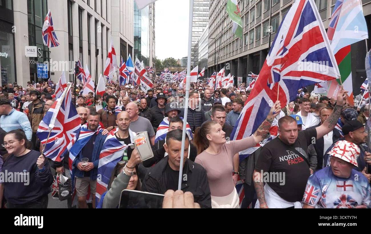 People taking part in a Tommy Robinson-led Unite the Kingdom march and ...