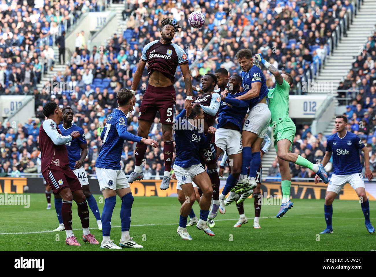 Tyrone Mings of Aston Villa heads the ball over during the Premier ...