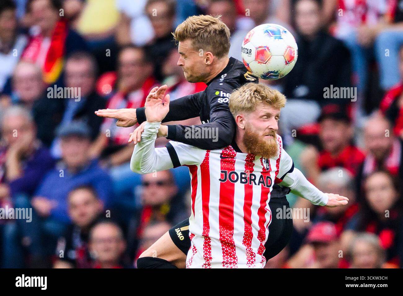 Stuttgart's Maximilian Mittelstaedt, left, and Freiburg's Jan-Niklas ...