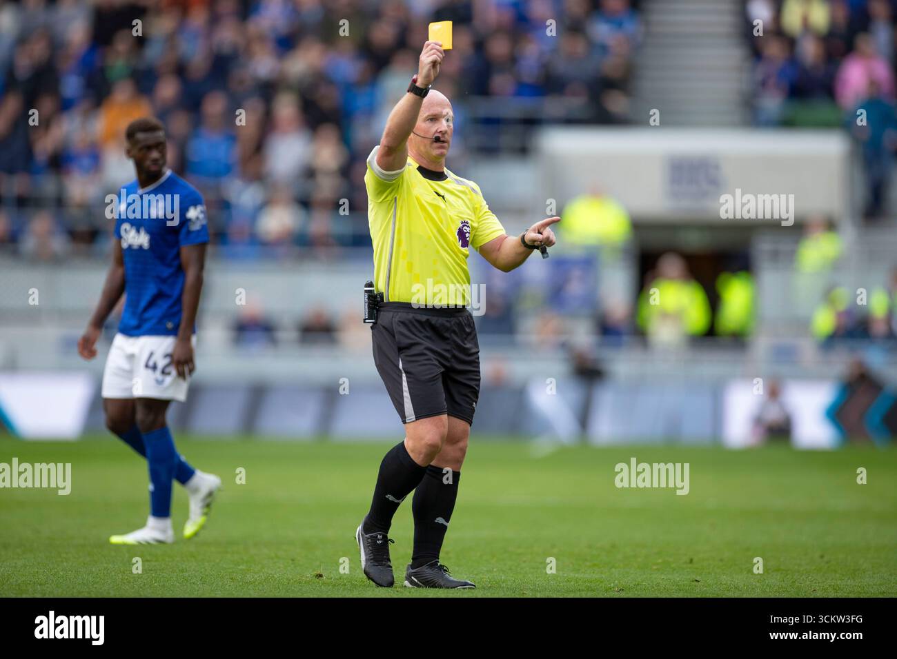 Referee, shows a yellow card to Matty Cash #2 of Aston Villa F.C during ...