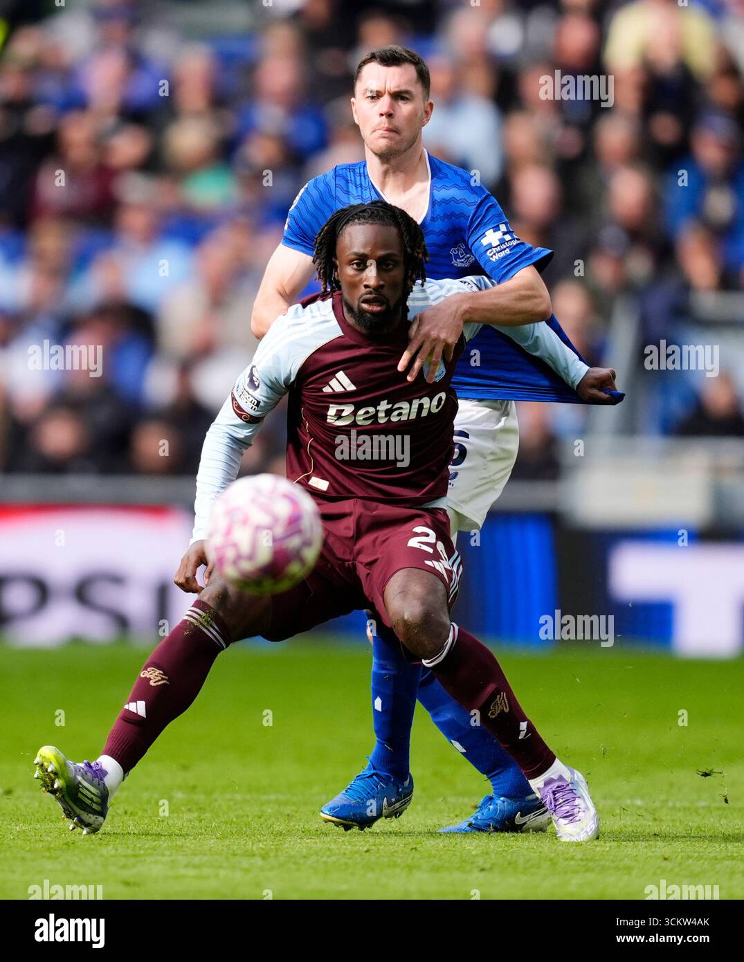 Aston Villa's Evann Guessand and Everton's Michael Keane (right) battle ...