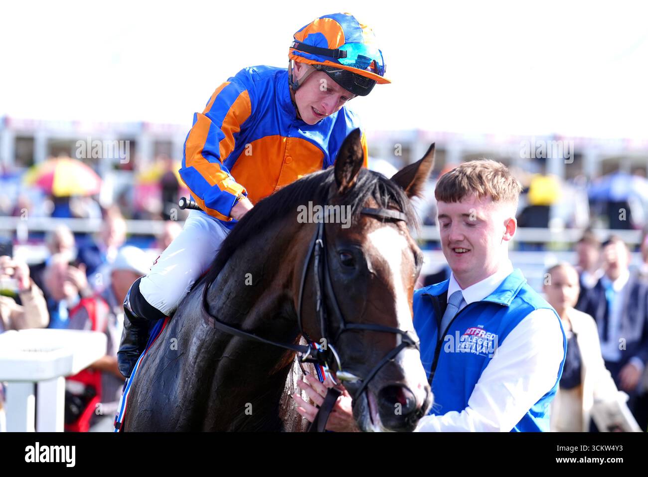 Jockey Tom Marquand celebrates after victory in the Betfred St Leger ...