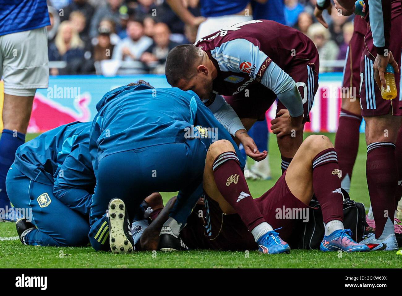 Tyrone Mings of Aston Villa down injured during the Premier League ...