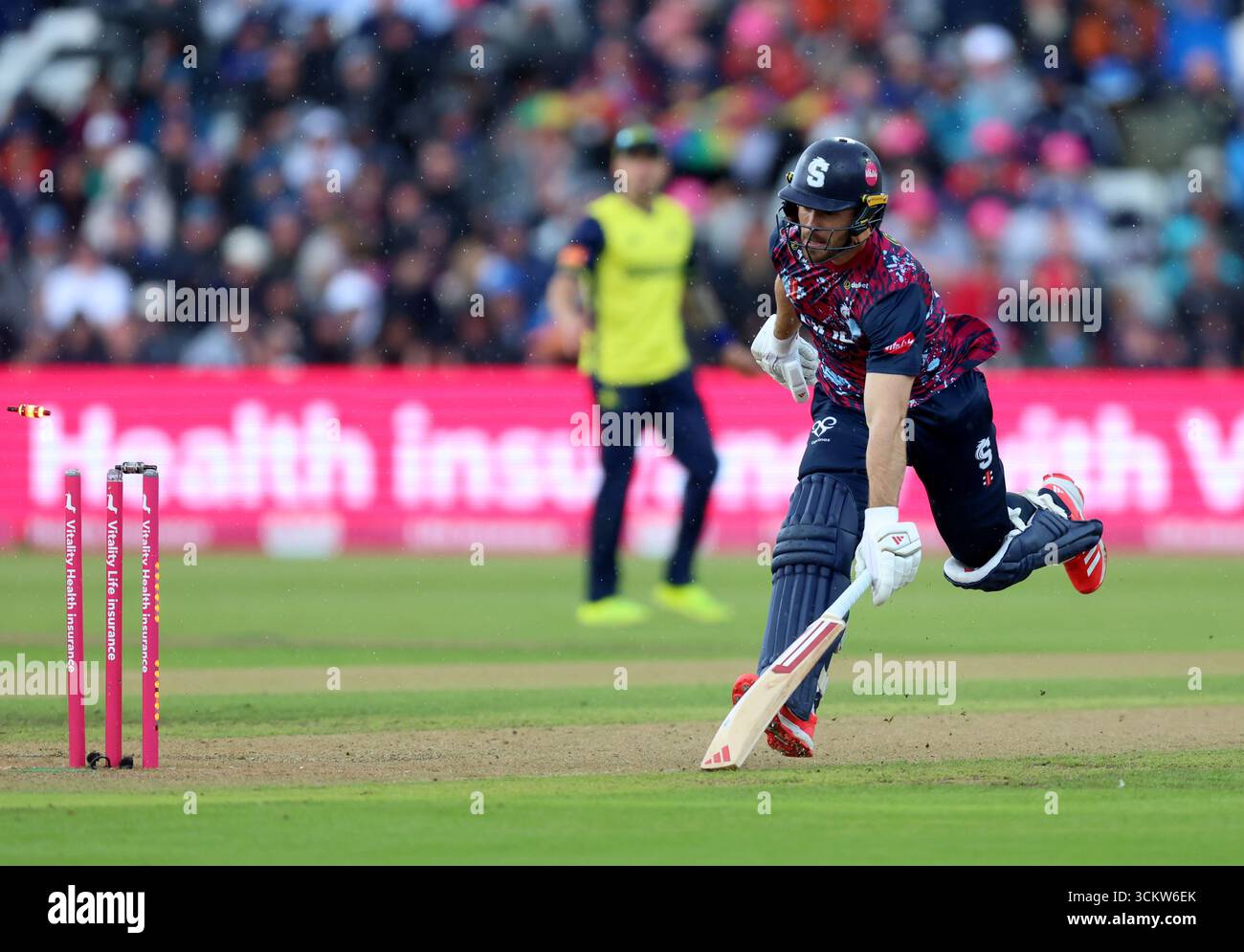 Northamptonshire's Lewis McManus is run out by James Vince during the ...