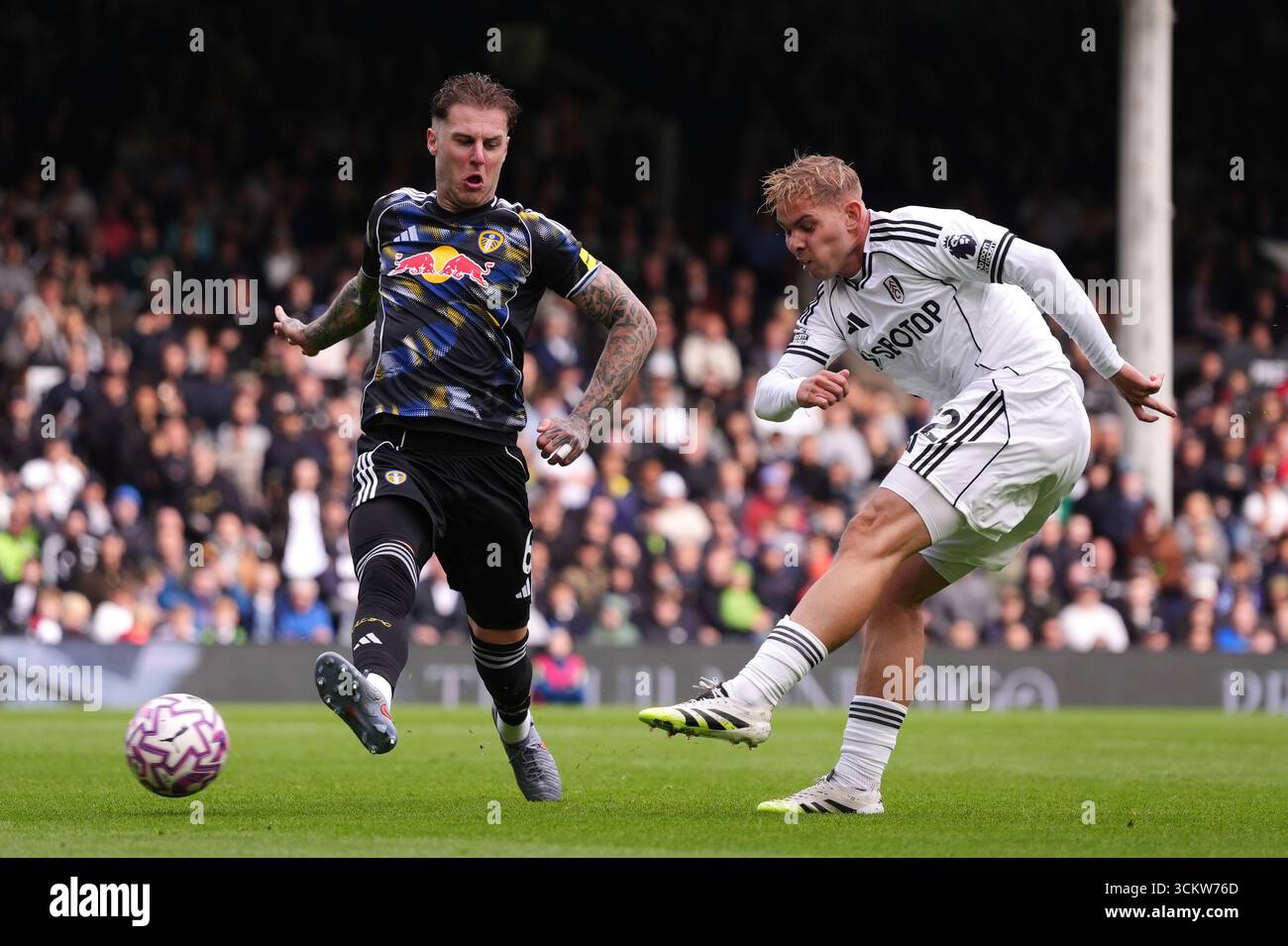Leeds United's Joe Rodon (left) tries to block a shot on goal by Fulham ...