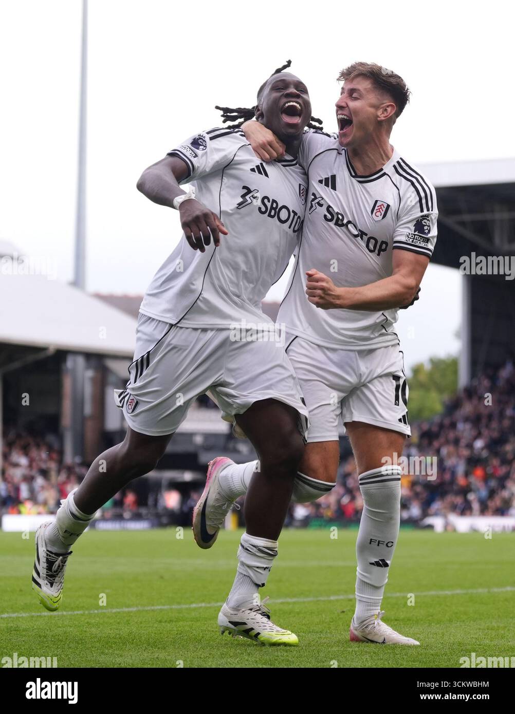 Fulham's Calvin Bassey (left) and Tom Cairney celebrate their side's ...