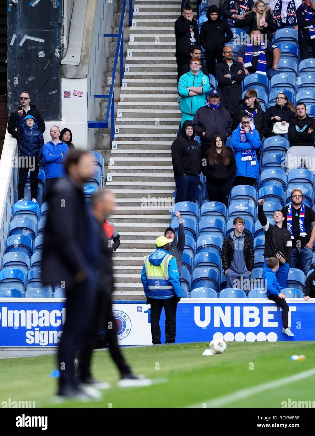 Rangers fans in the stands shout abuse at manager Russell Martin during ...