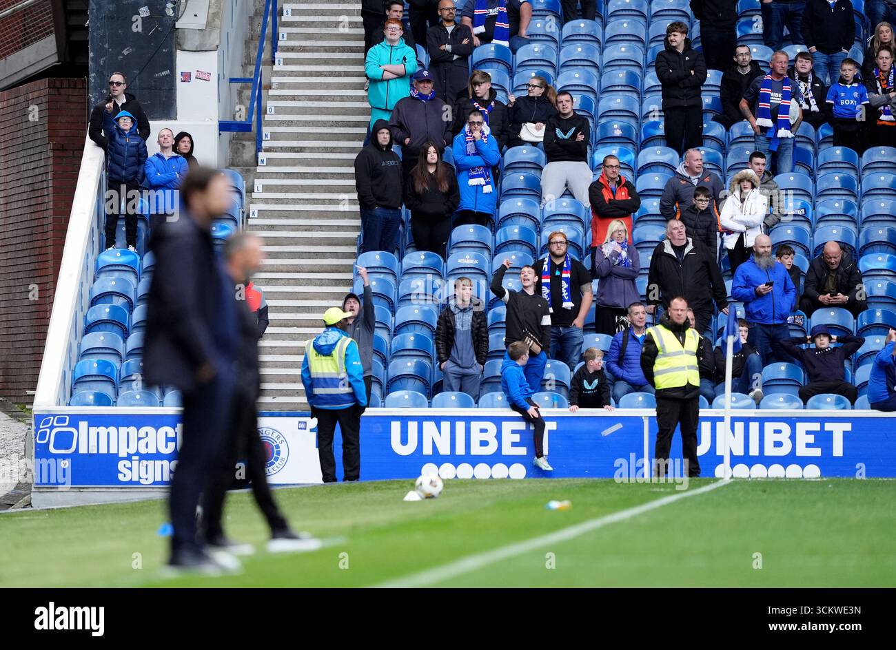 EDITORS NOTE GESTURE Rangers fans in the stands shout abuse at manager ...