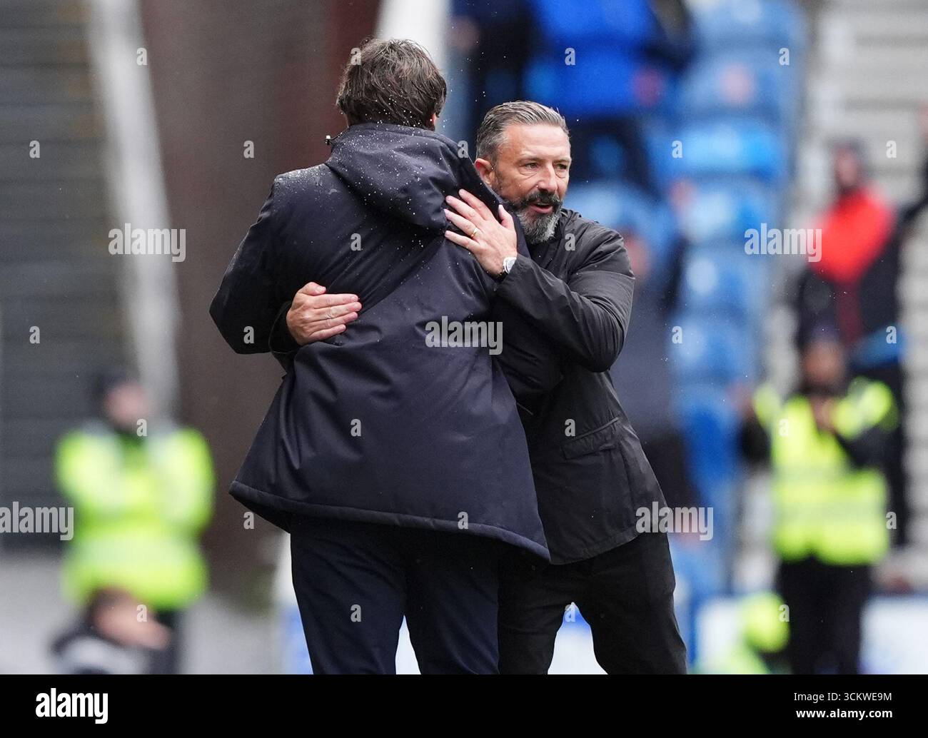 Rangers manager Russell Martin (left) congratulates Heart of Midlothian ...